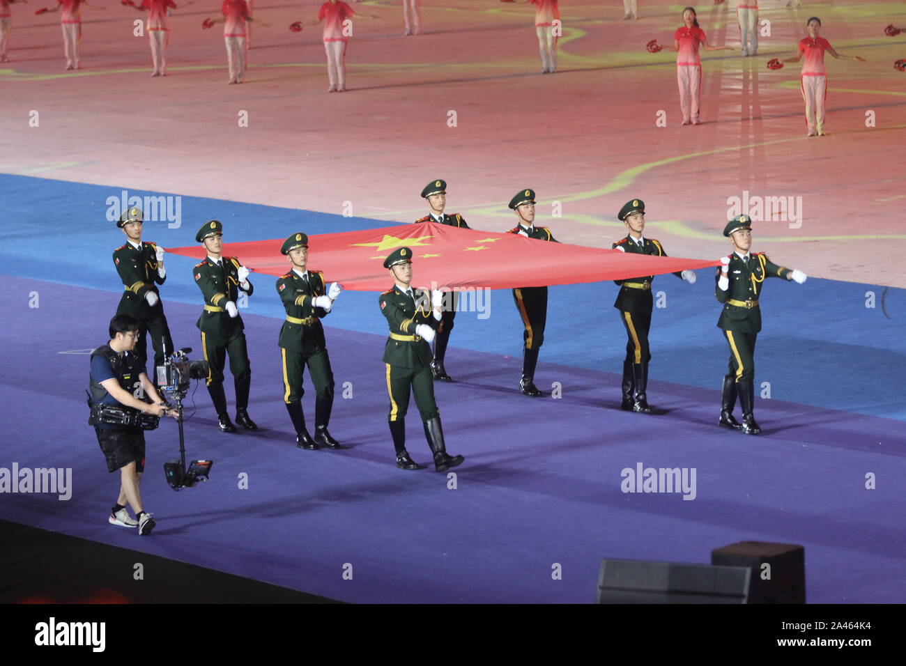 Soilders carrying a Chinese flag parade at the openning ceremony of the ...
