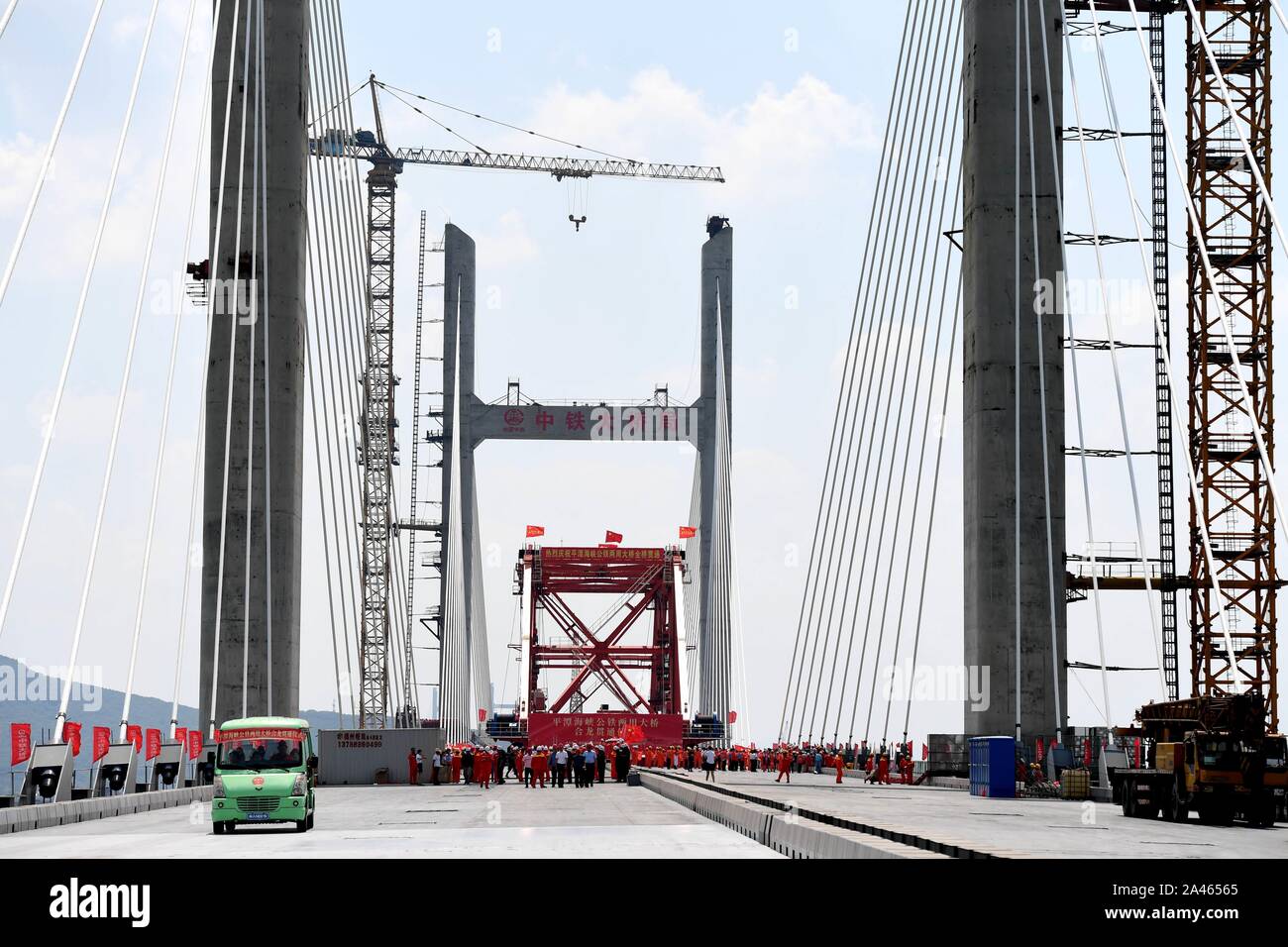 Chinese workers labor at the Pingtan Strait Road-rail Bridge, the world ...