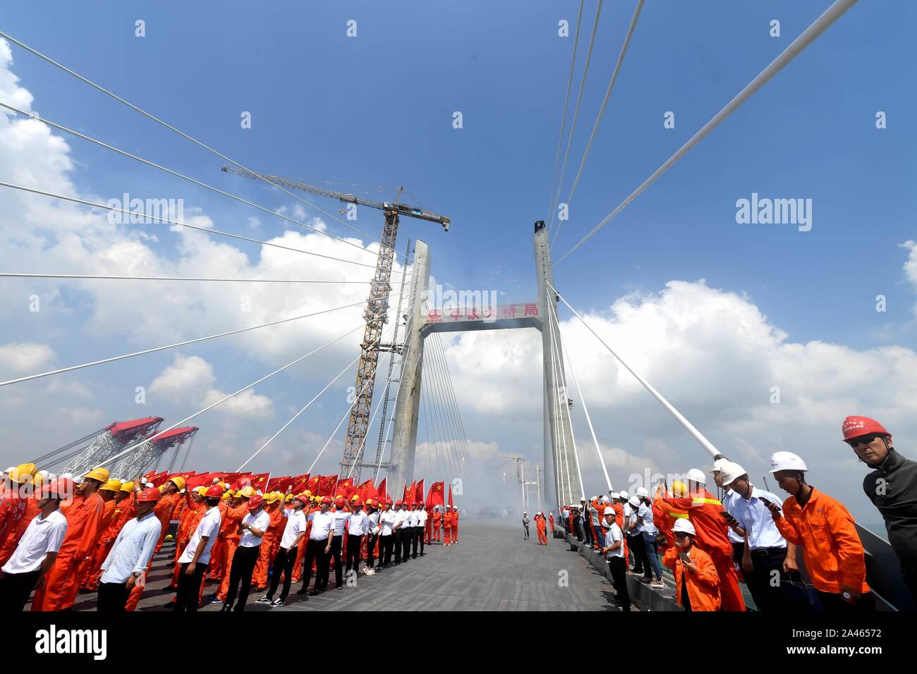 Chinese workers labor at the Pingtan Strait Road-rail Bridge, the world ...