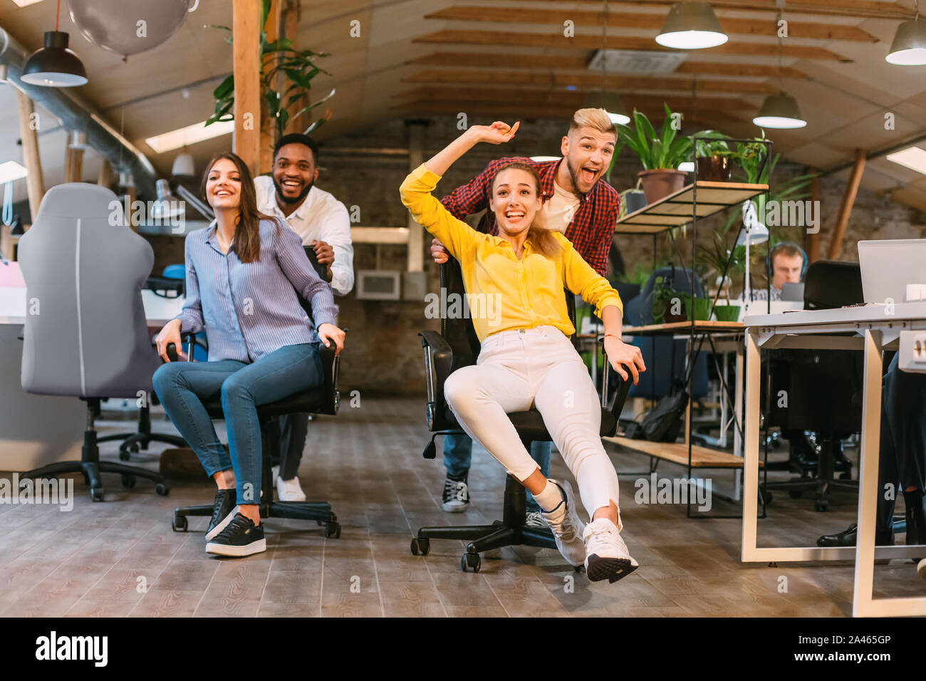 Time for break. Joyful colleagues having fun at workplace Stock Photo ...