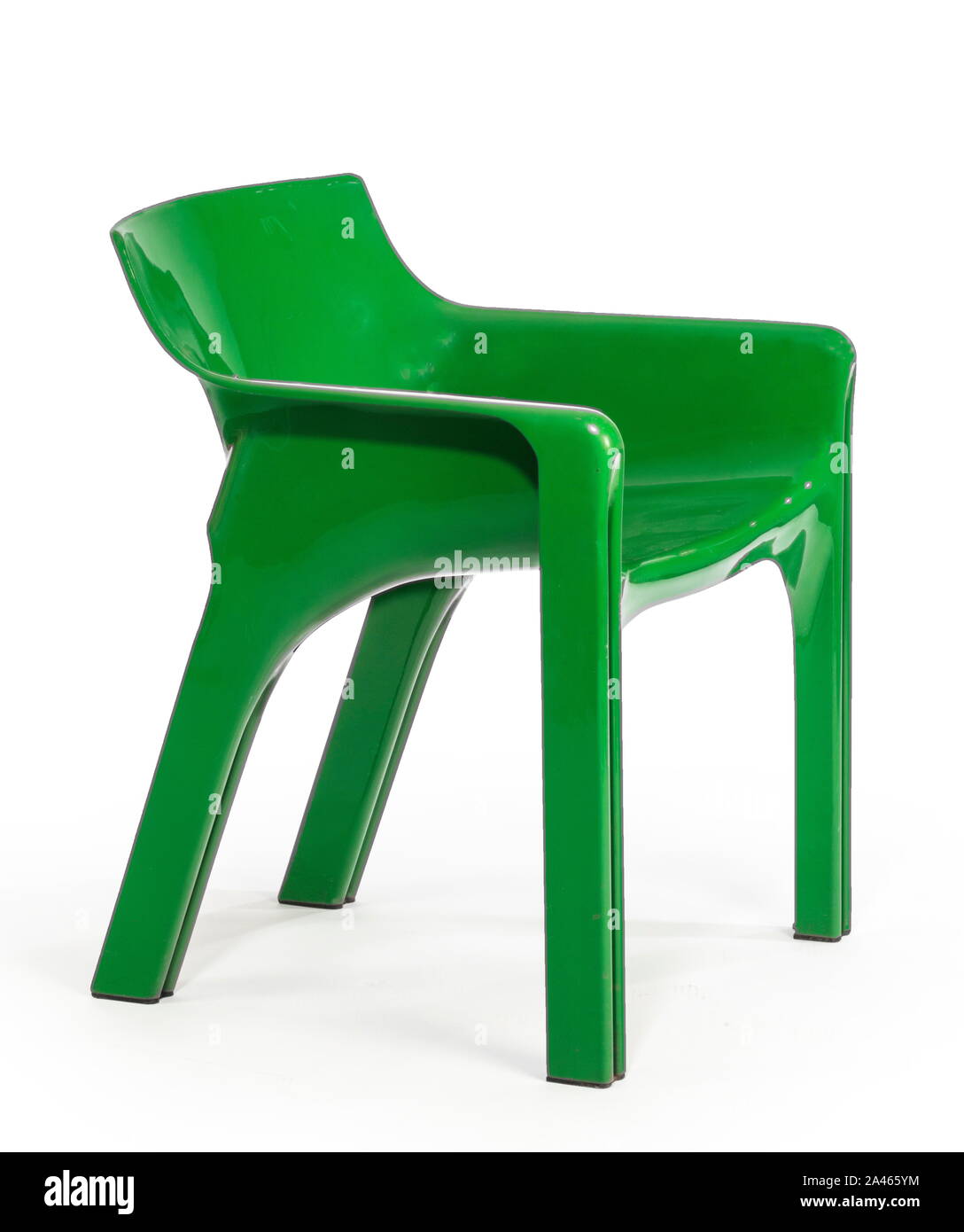 green plastic stackable outdoor garden patio arm chair Stock Photo - Alamy