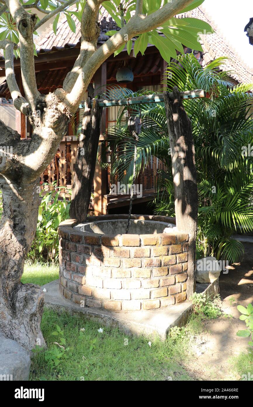 Brick water well wooden roof hi-res stock photography and images - Alamy