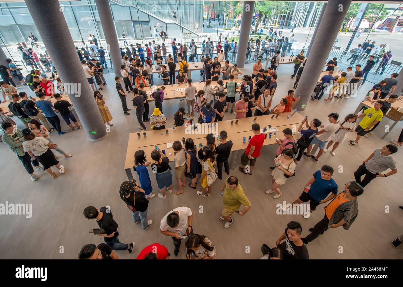 Customers shop at the Huawei global flagship store in Shenzhen, south ...
