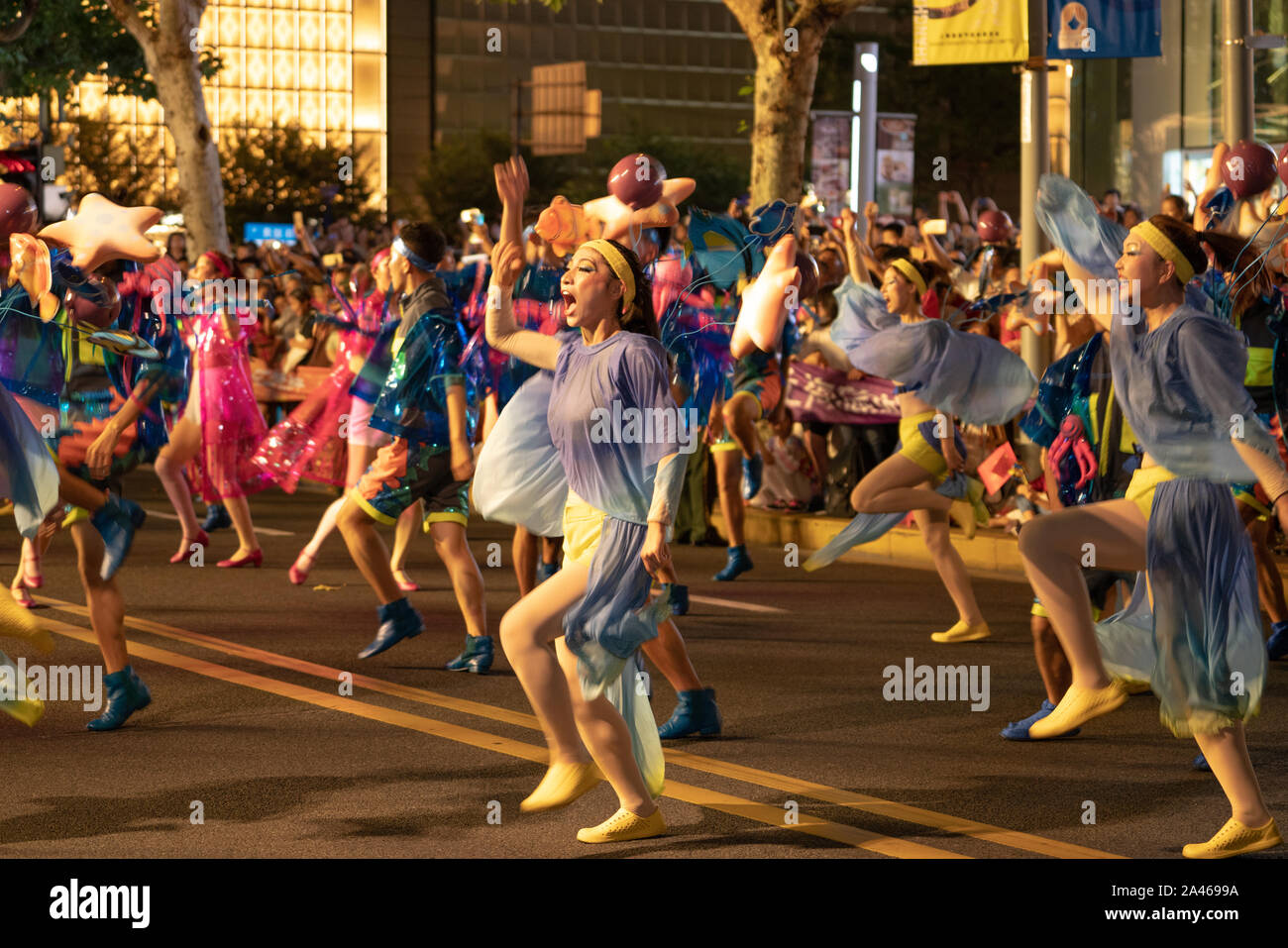 Performers dance and play the instruments during the fancy parade of ...