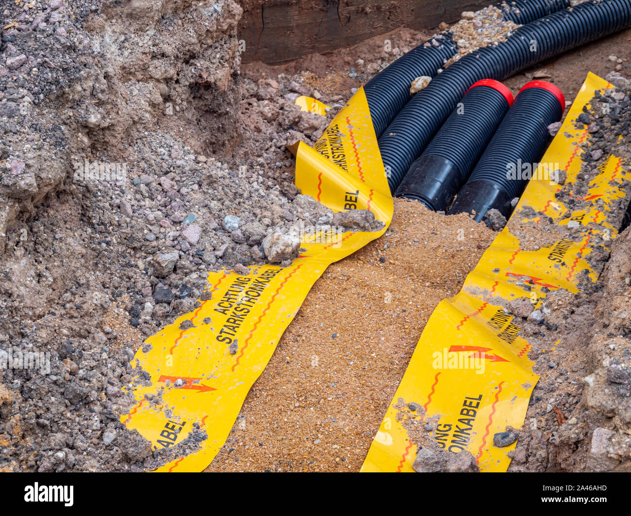 Attention Power cables in the earth Stock Photo - Alamy