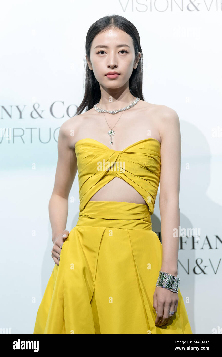 Chinese actress Zhou Yutong wears a bright yellow dress attending the ...