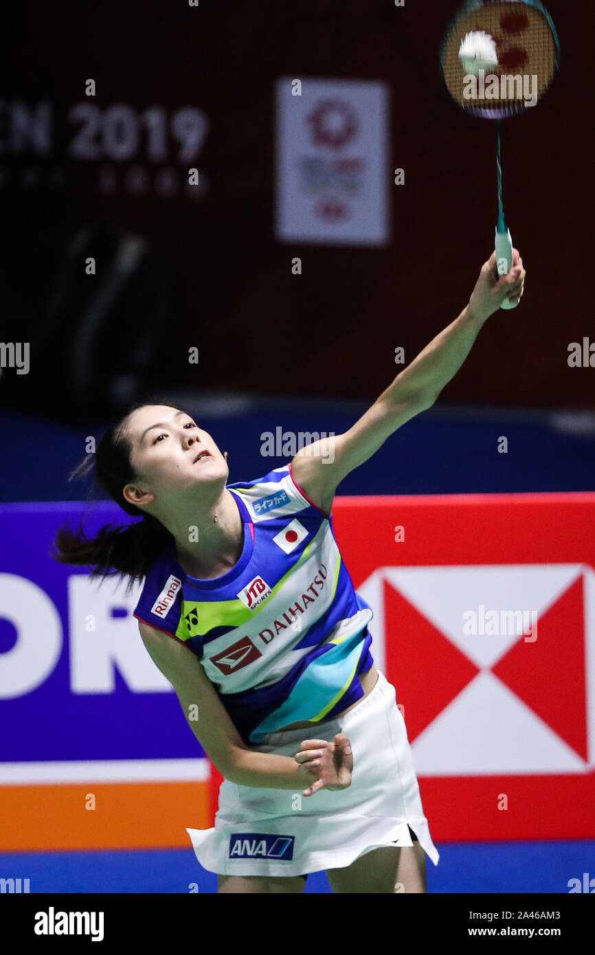 Japanese professional badminton player Aya Ohori competes against Hong ...
