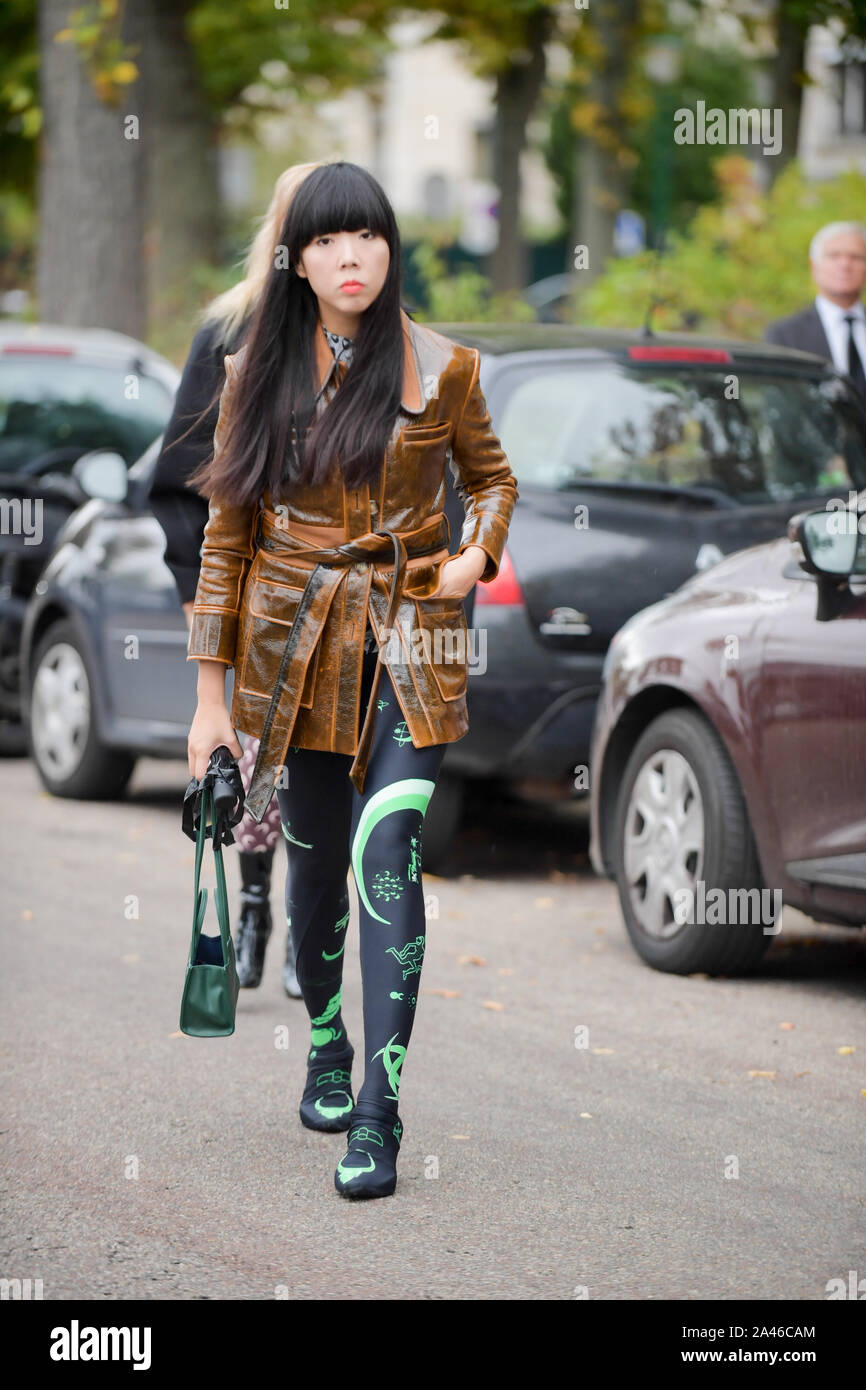 A trendy woman poses for street snap during the Paris Fashion Week ...