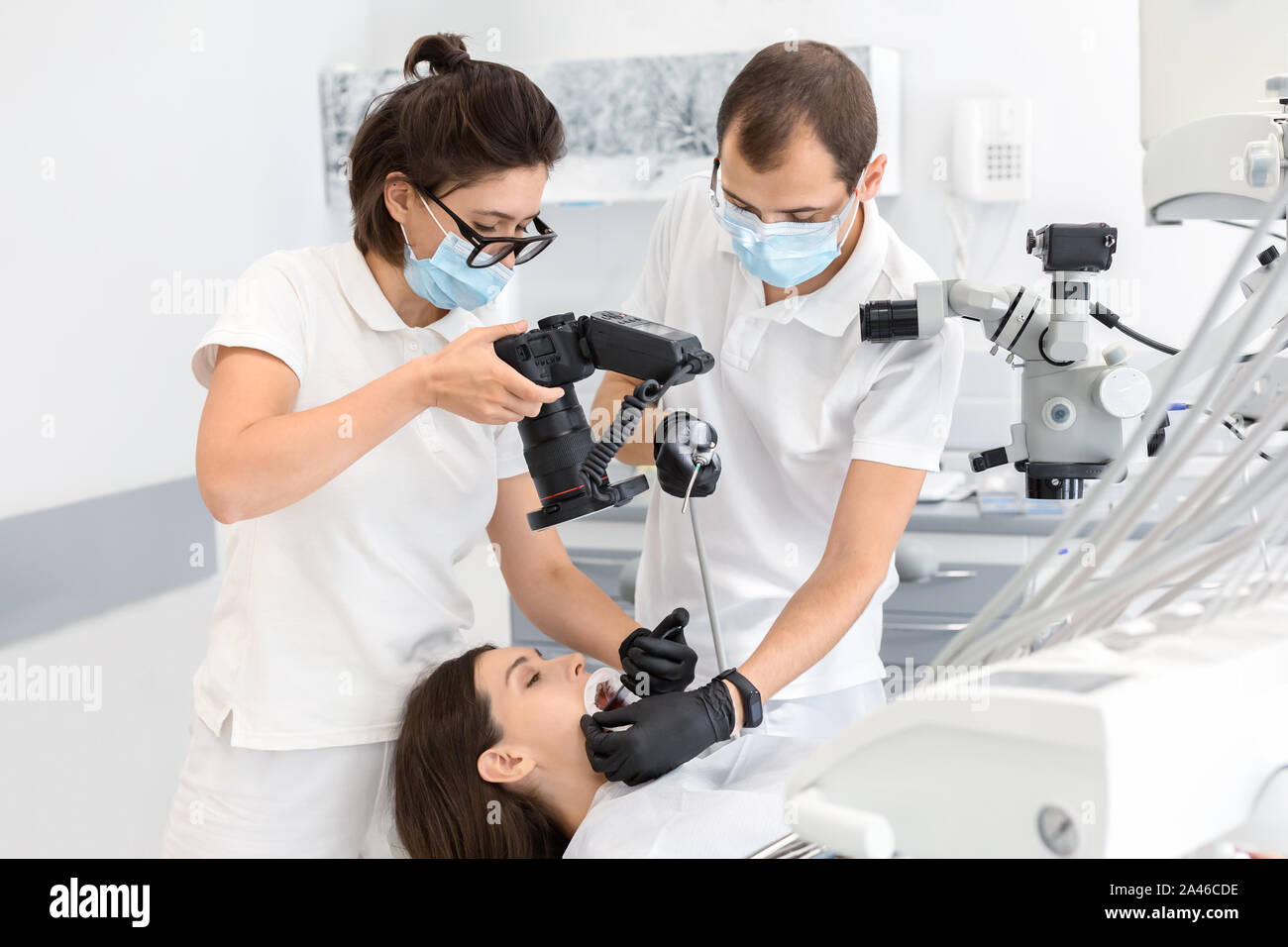 Professional dentist taking photo of patient teeth Stock Photo - Alamy