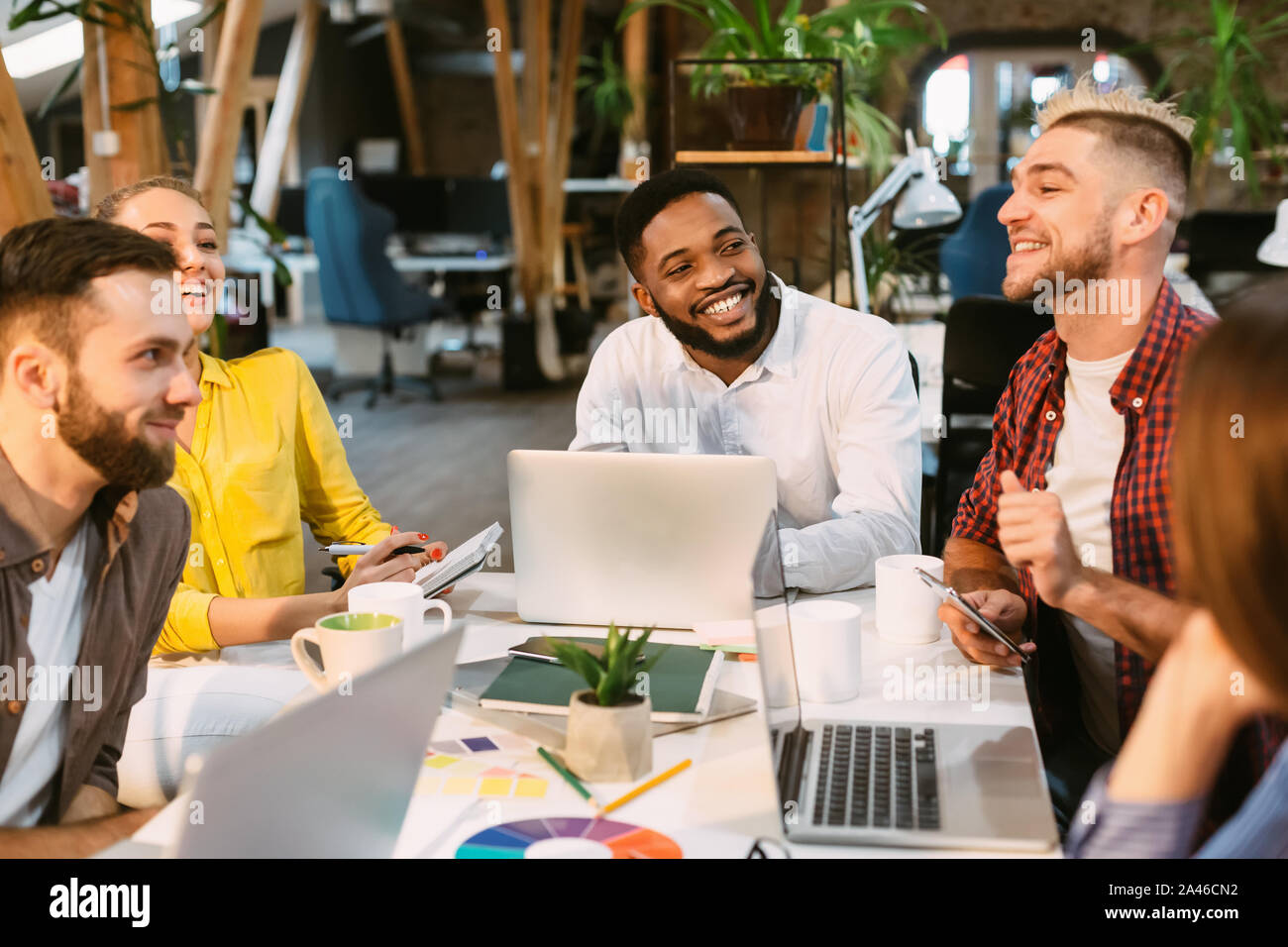 Team job. Young crew working with new startup project Stock Photo - Alamy