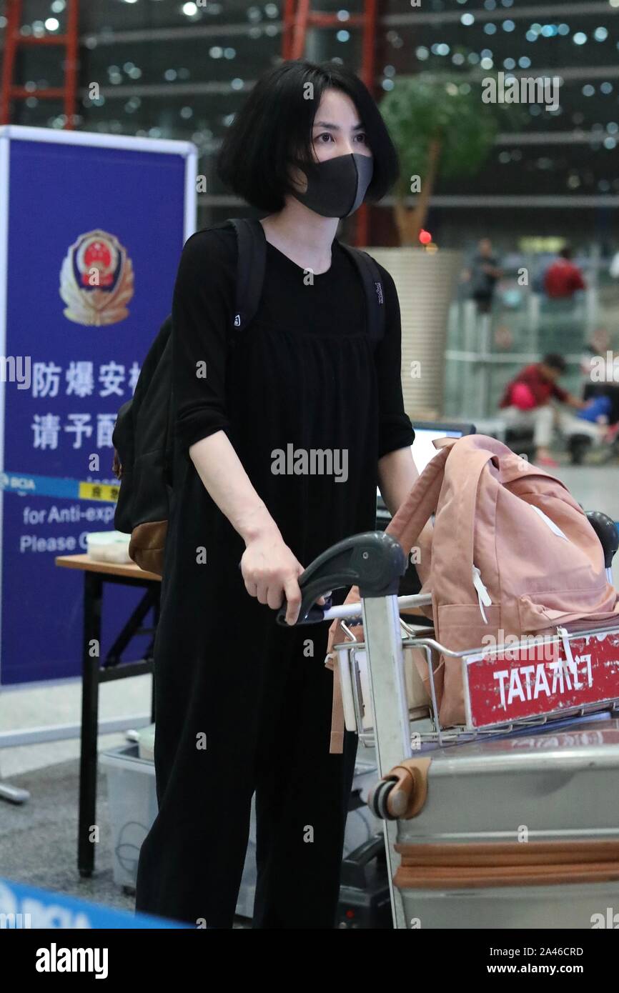 Hong Kong singer Faye Wong arrives at the Beijing Capital International ...