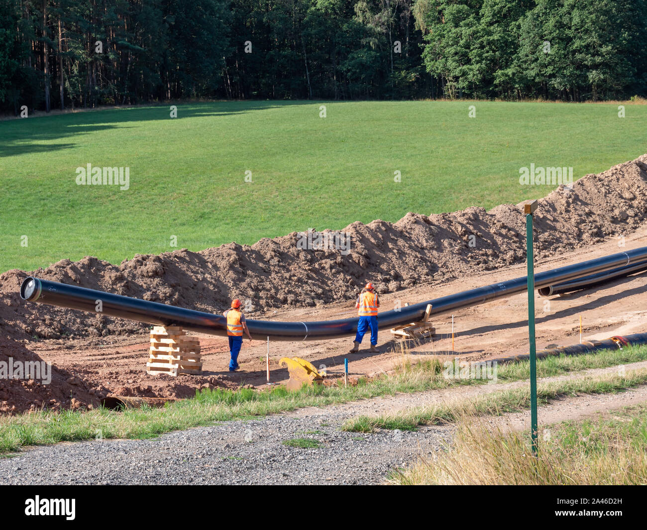 Laying a district heating pipe Stock Photo - Alamy