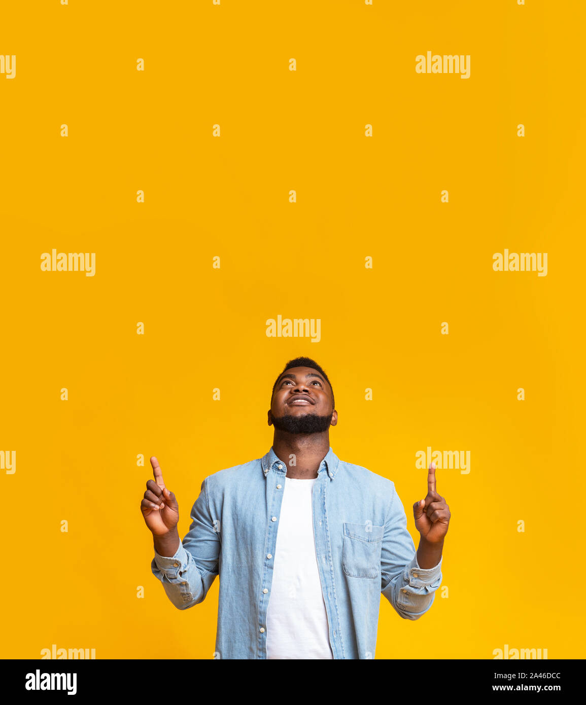 Young man pointing fingers top hi-res stock photography and images - Alamy