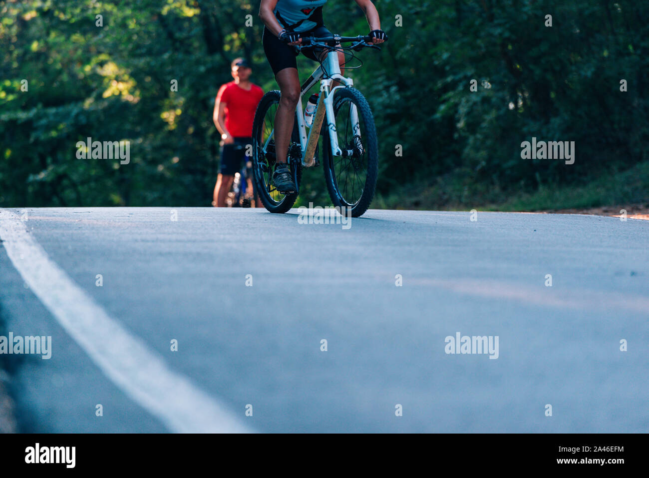 Tall handsome biker rides his bicycle on sunset in a lovely magical ...