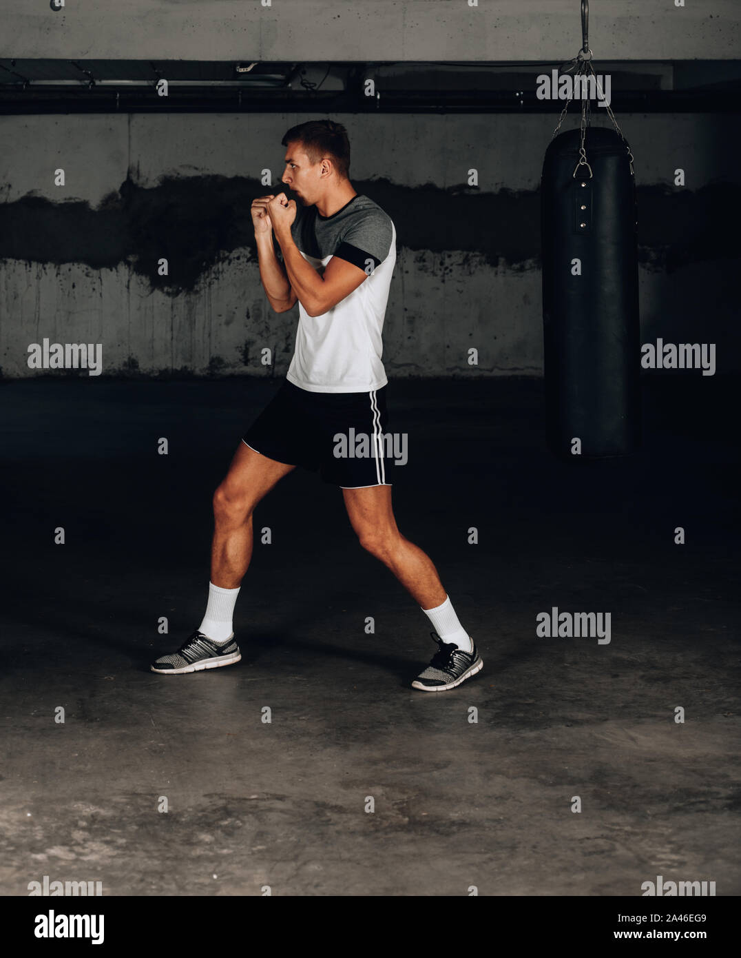Man throwing a fierce and powerful punch. Photo of muscular man ...