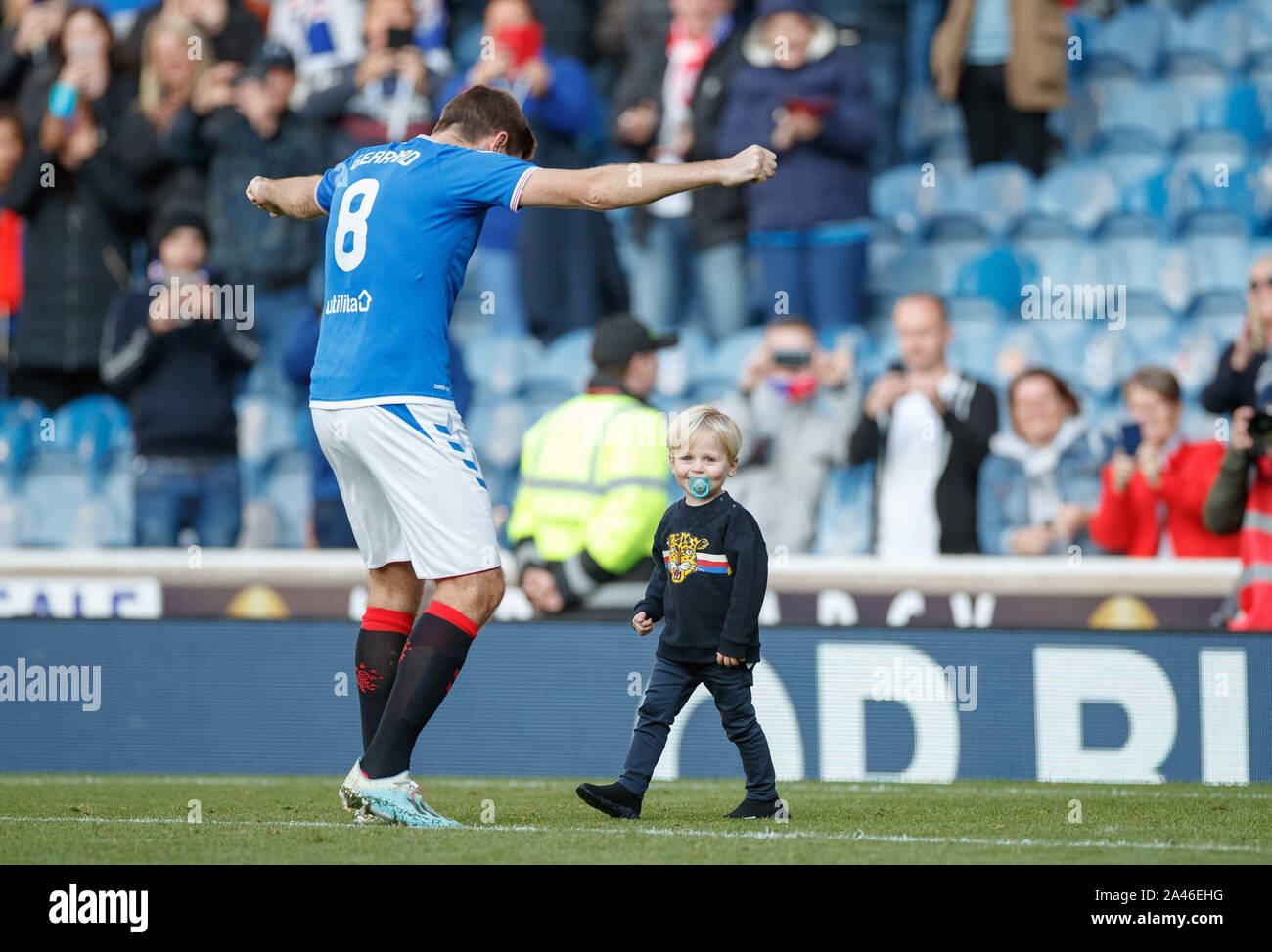 Steven Gerrard with his son Lio on the pitch after the legends match at ...