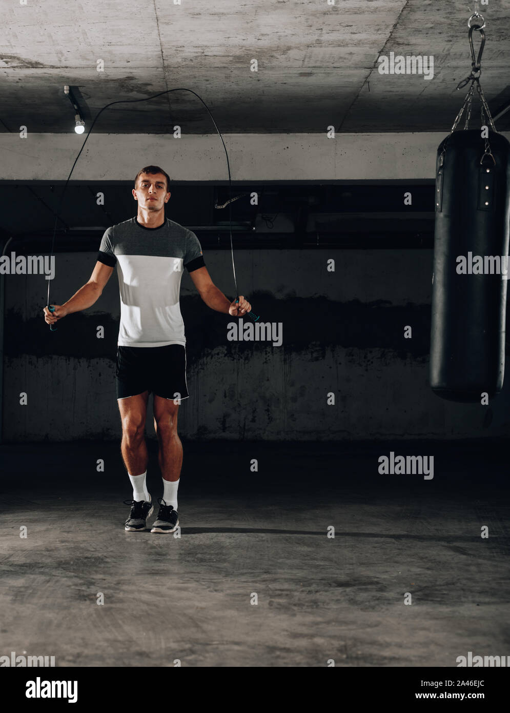 Athletic man jumping warming up hi-res stock photography and images - Alamy