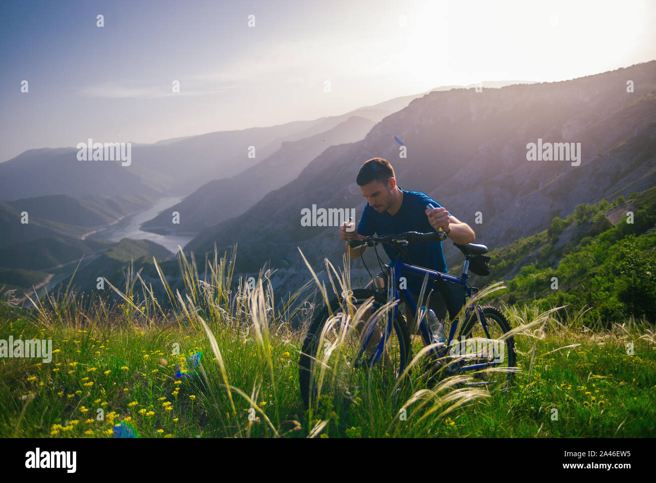 Downhill rider pushing bike hi-res stock photography and images - Alamy