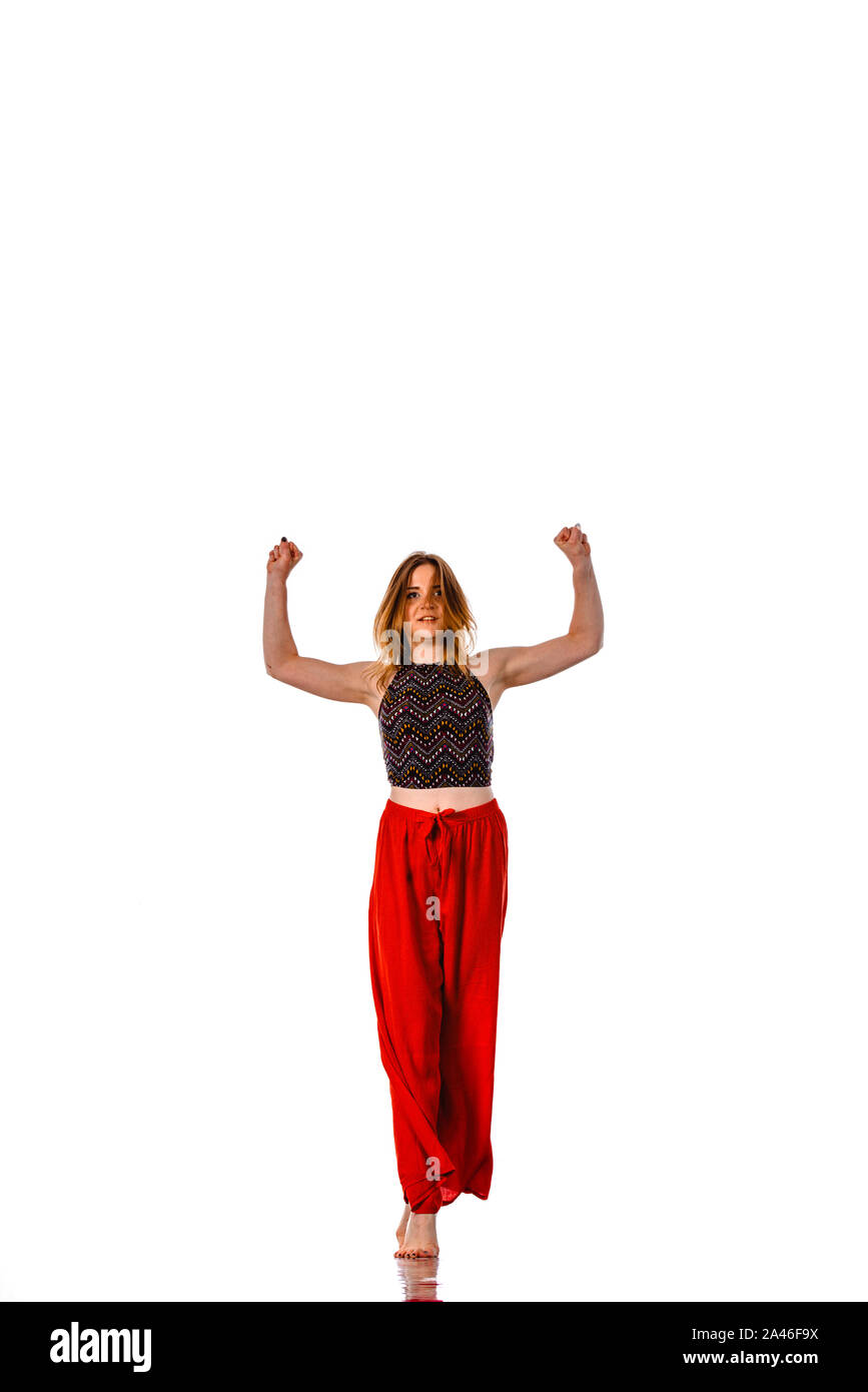 Joyful passionate woman dancing dance aerobics with raised arms. Full ...