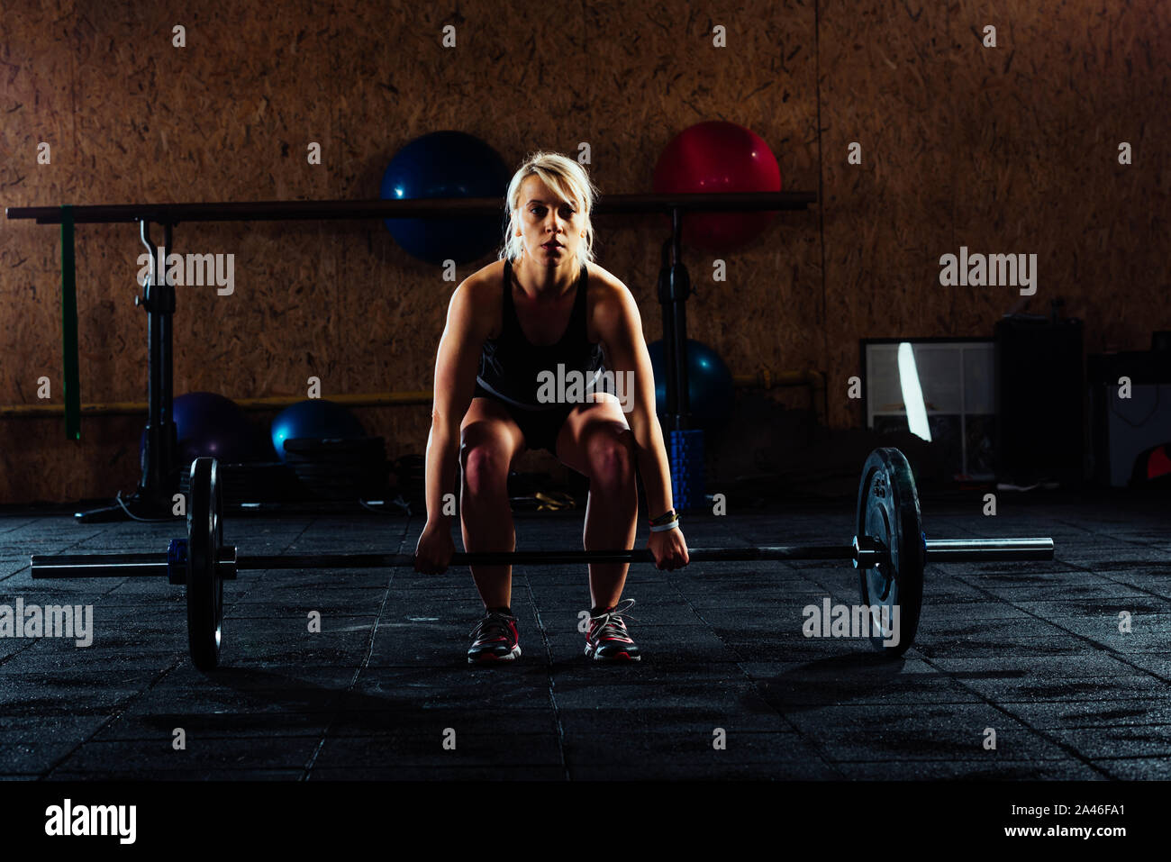 Strong girl is having gym workout routine Stock Photo - Alamy