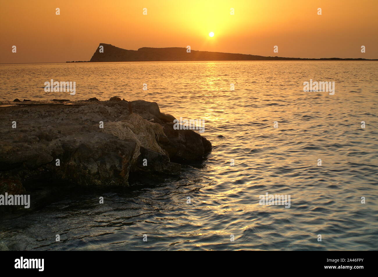 sunset in Crete coastline Stock Photo - Alamy
