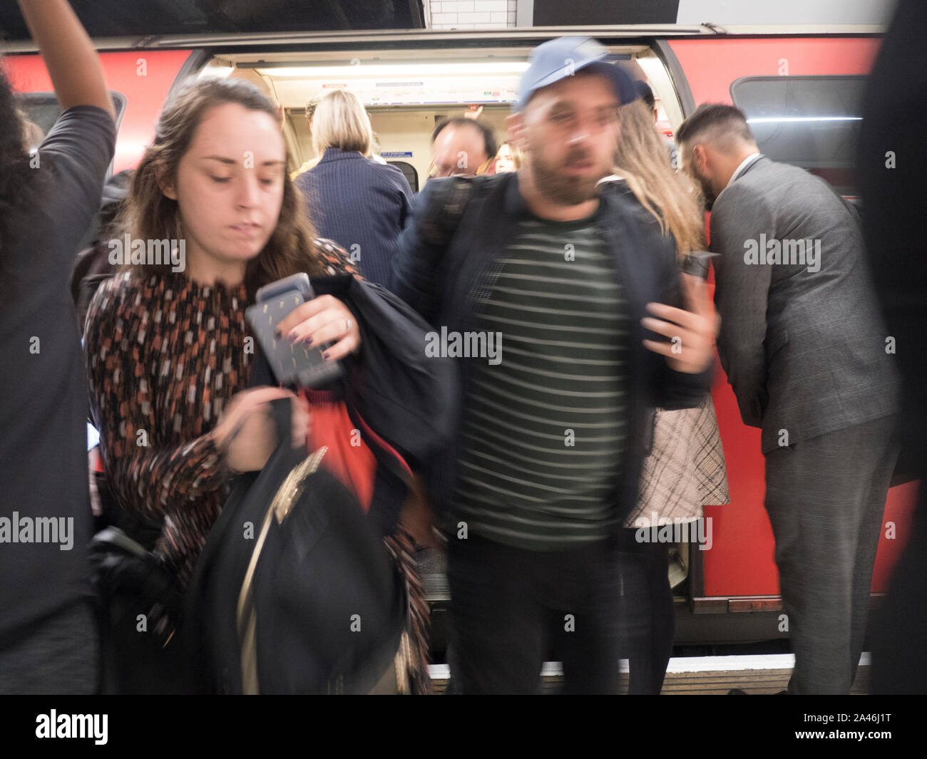 Evening rush hour on the London underground tube network, passengers ...