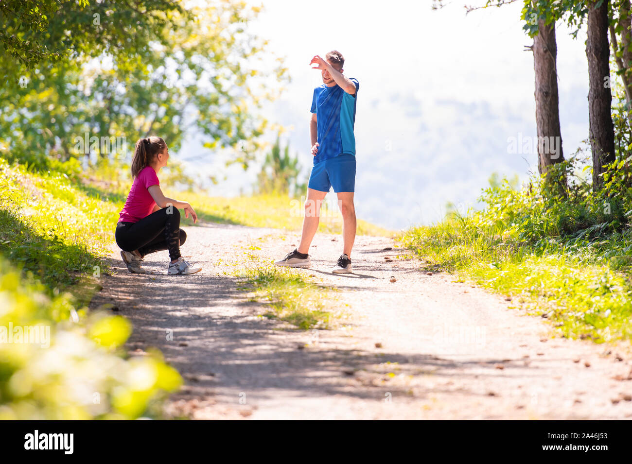 young happy couple enjoying in a healthy lifestyle warming up and ...