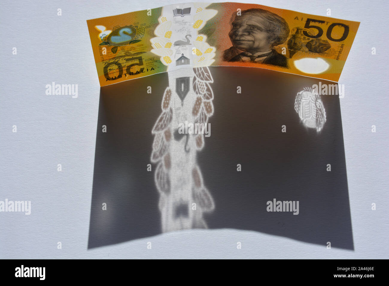 Australia fifty dollar banknote standing on edge, backlit through ...