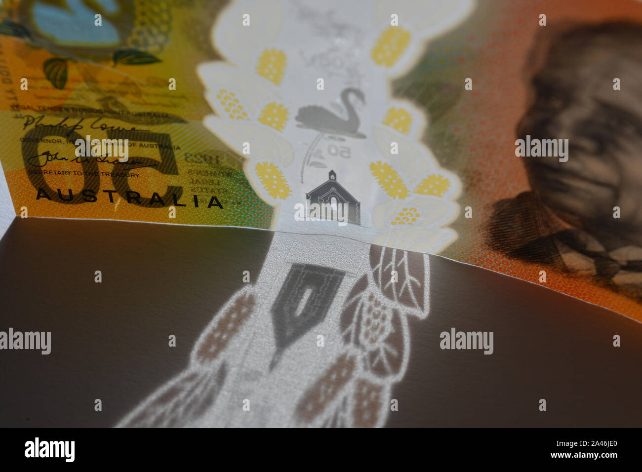 Australia fifty dollar banknote standing on edge, backlit through ...