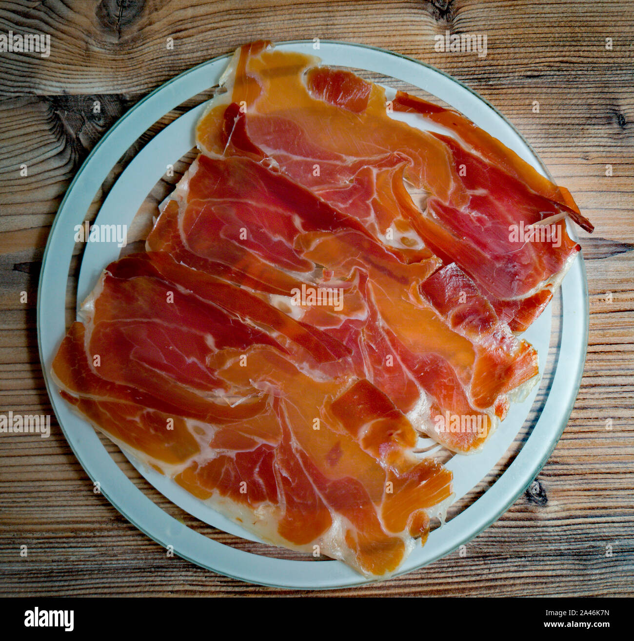 Spanish tapa of Serrano ham Stock Photo - Alamy
