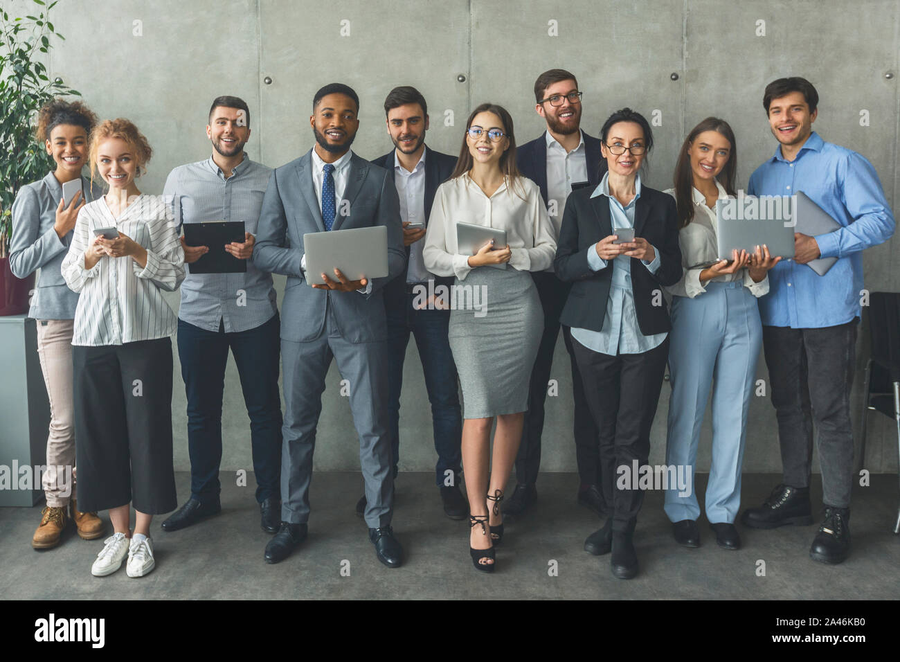 Successful business team. Motivated colleagues smiling to camera Stock ...