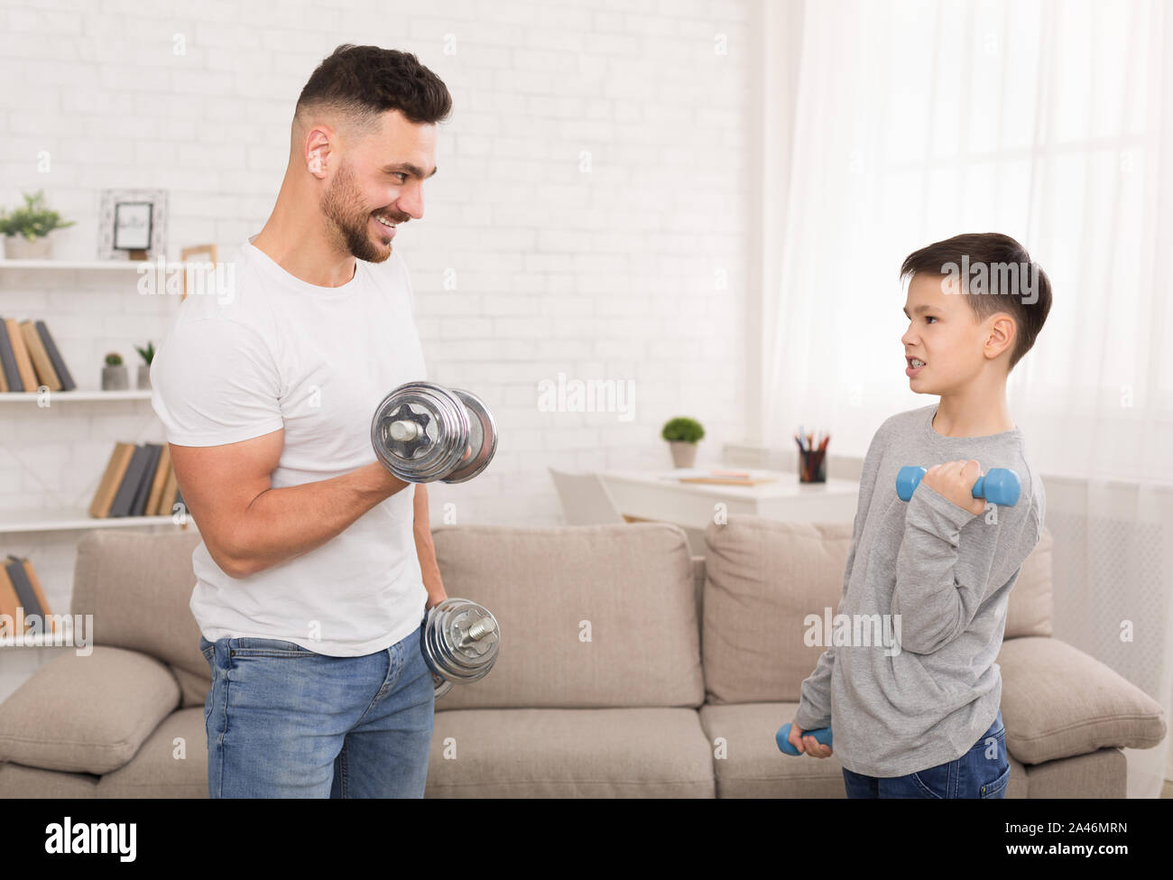 Child lifting weights hi-res stock photography and images - Alamy