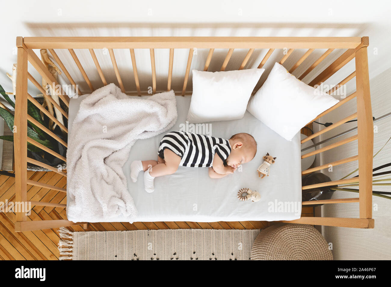 Top view of adorable newborn baby sleeping in wooden crib Stock Photo ...