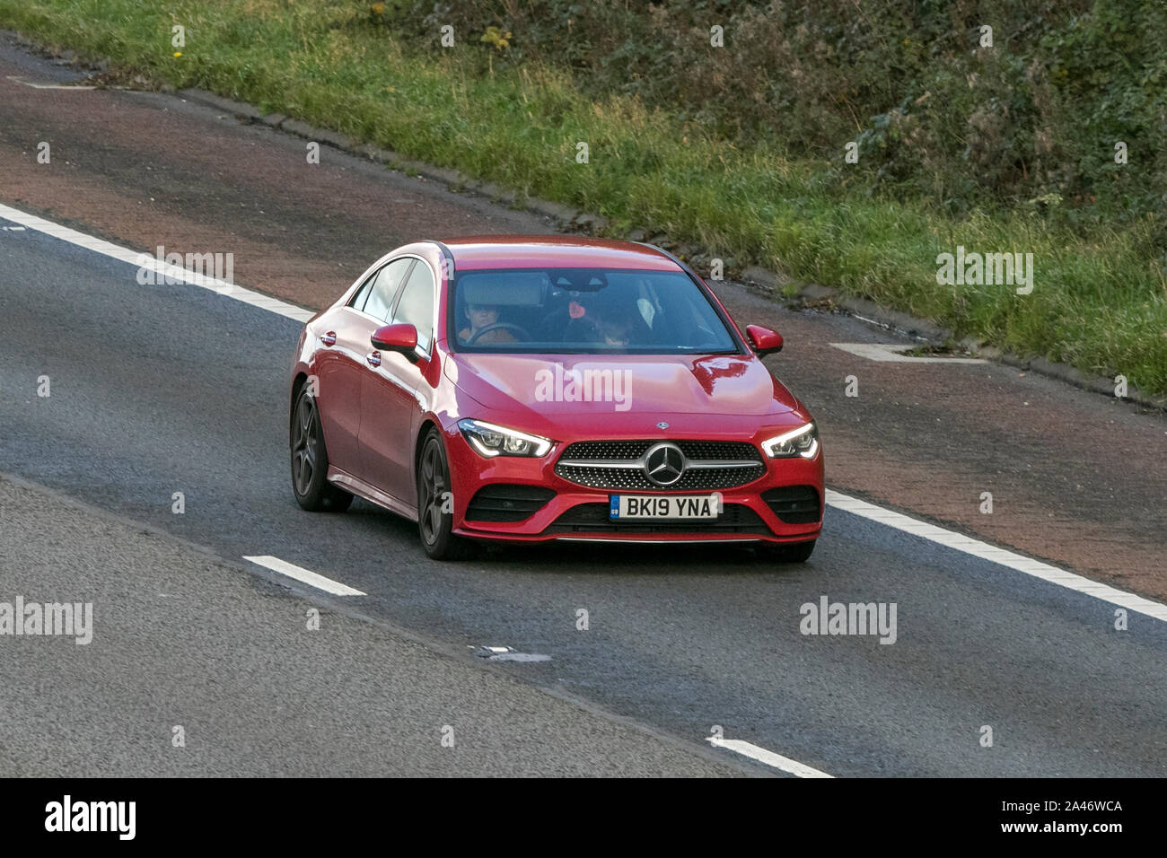 2019 red Mercedes-Benz CLA 200 AMG Line Premium; traveling on the M6 ...