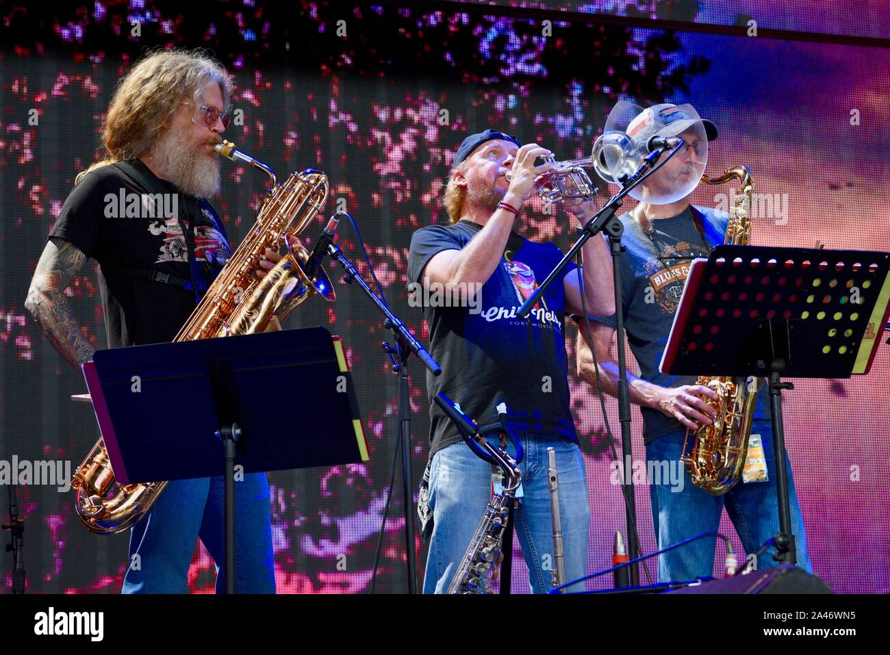 Band members performing for country music star and celebrity musician ...