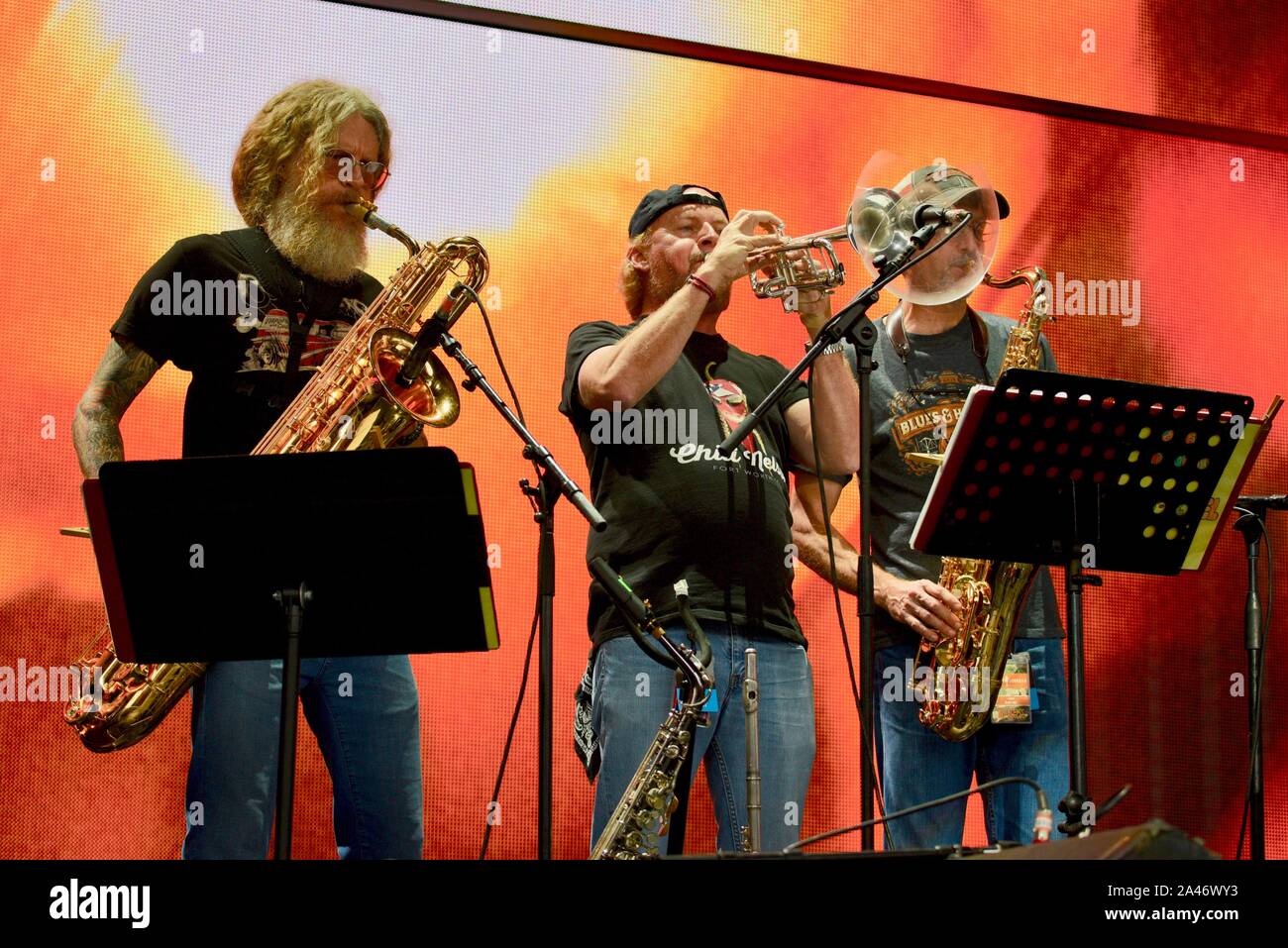 Band members performing for country music star and celebrity musician ...