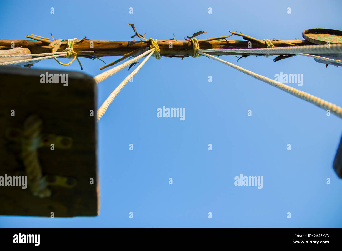 The old rope wooden swing. A regular home made swing made of rope and a ...