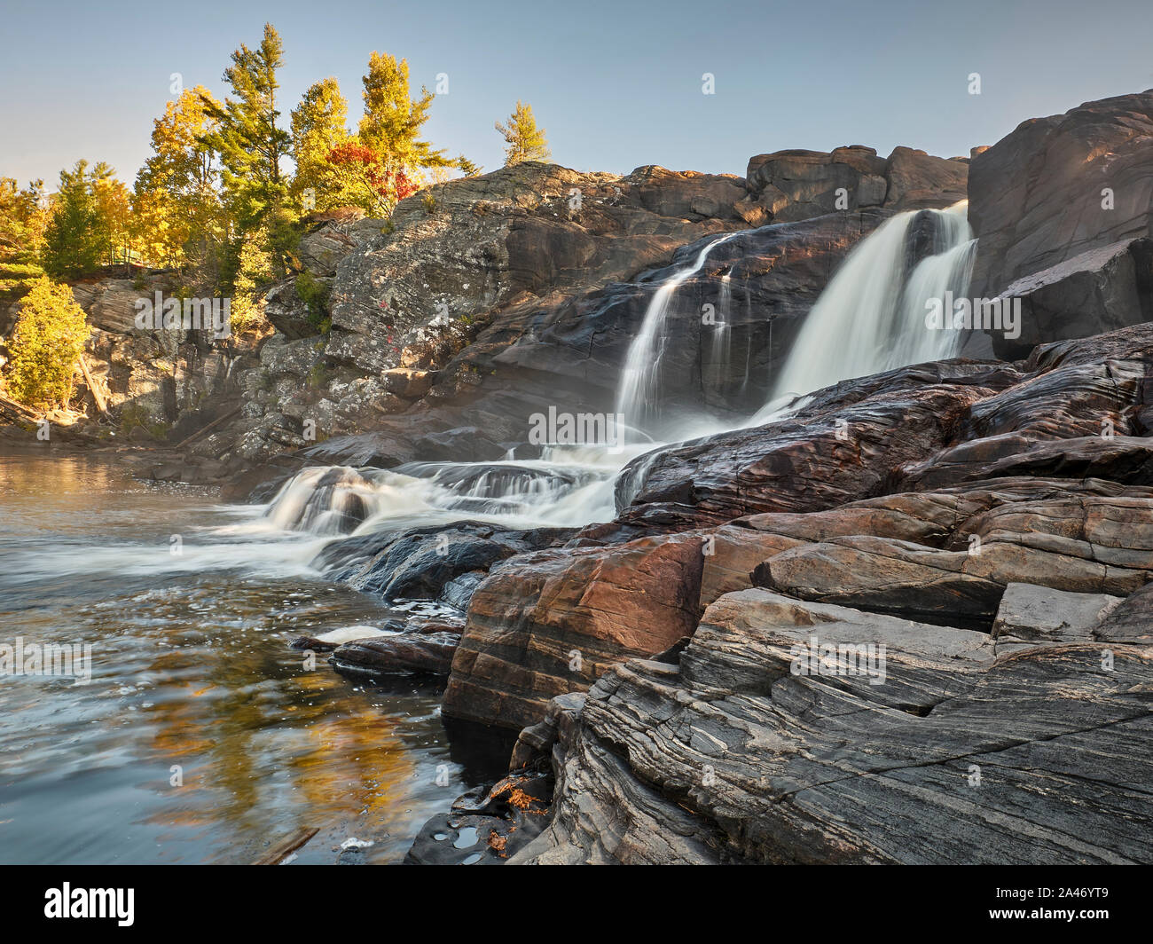 Low water levels flow over High Falls in Bracebridge Ontario on a crips ...