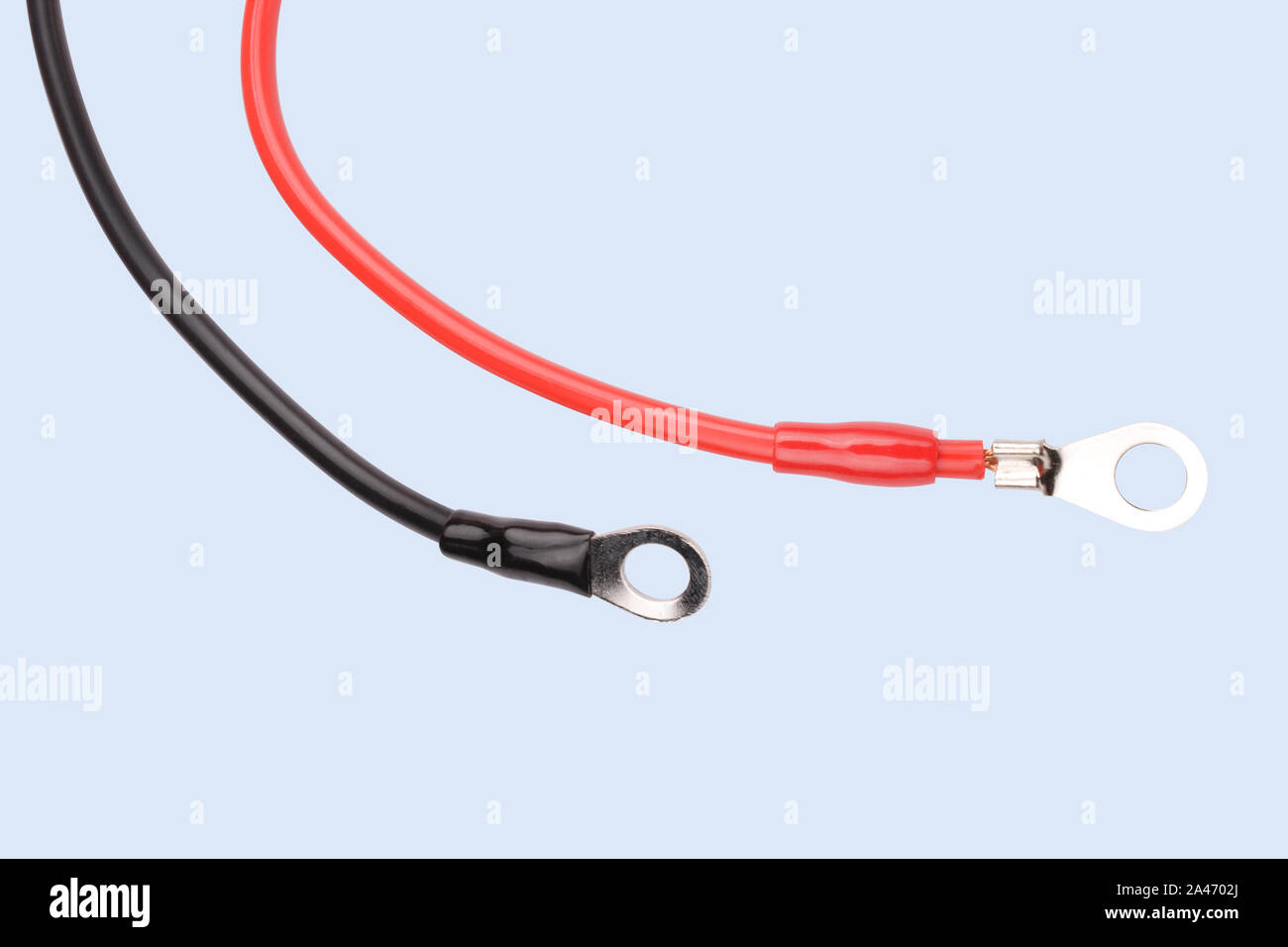 Two Wire Red and Black Isolated on Blue Stock Photo - Alamy