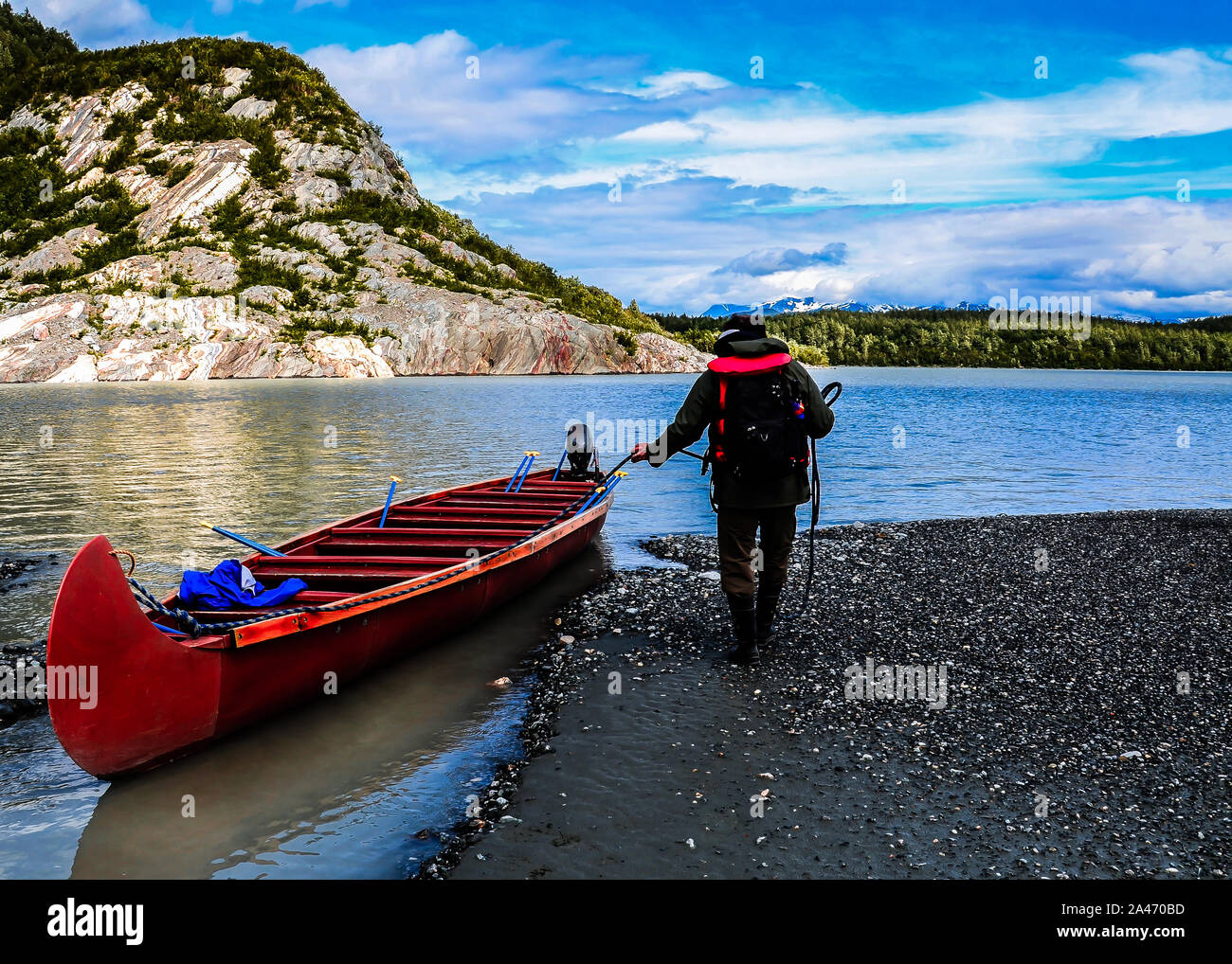 Landscape with an Excursion Guide and a Canoe on a River Bank of an ...