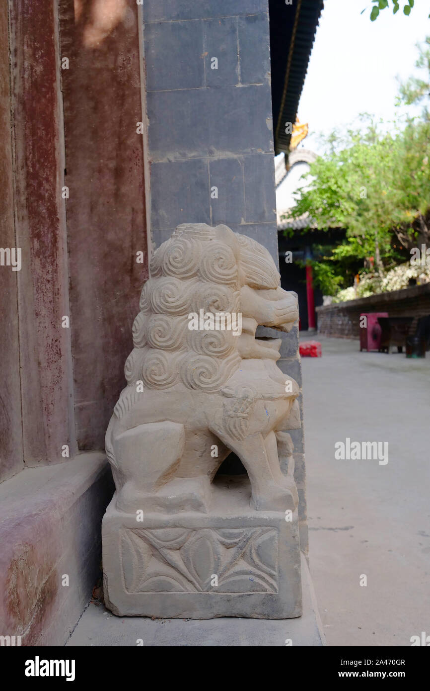 Stone rock lion statue in Tulou Temple of Beishan Mountain, Yongxing ...