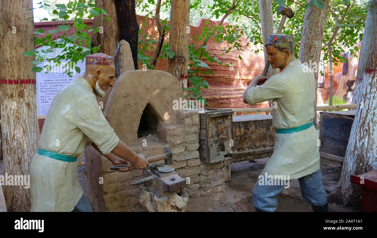 Mannequins work as a blacksmith forging iron in Turpan Karez Well ...