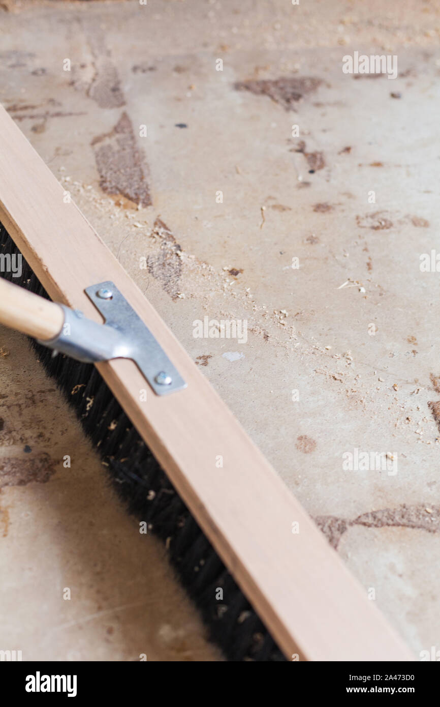 Sweep broom workshop, wood broom dust and wood shavings workshop floor ...