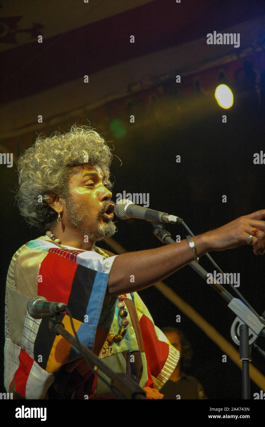 Paban Das Baul performs on a stage. He is known for pioneering ...
