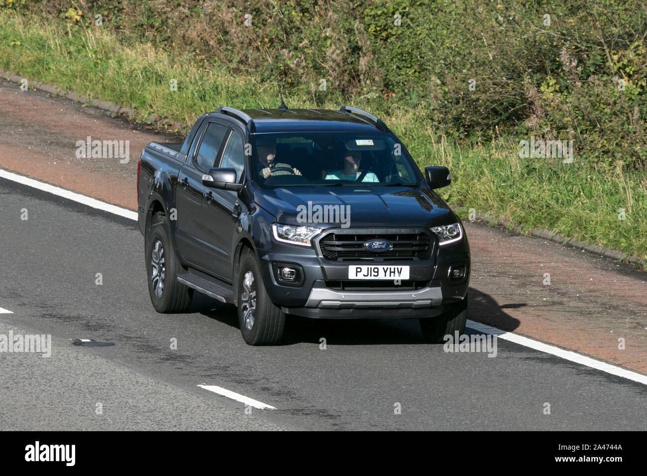 2019 black Ford Ranger Wildtrak Ecoblue 4; traveling on the M6 motorway ...