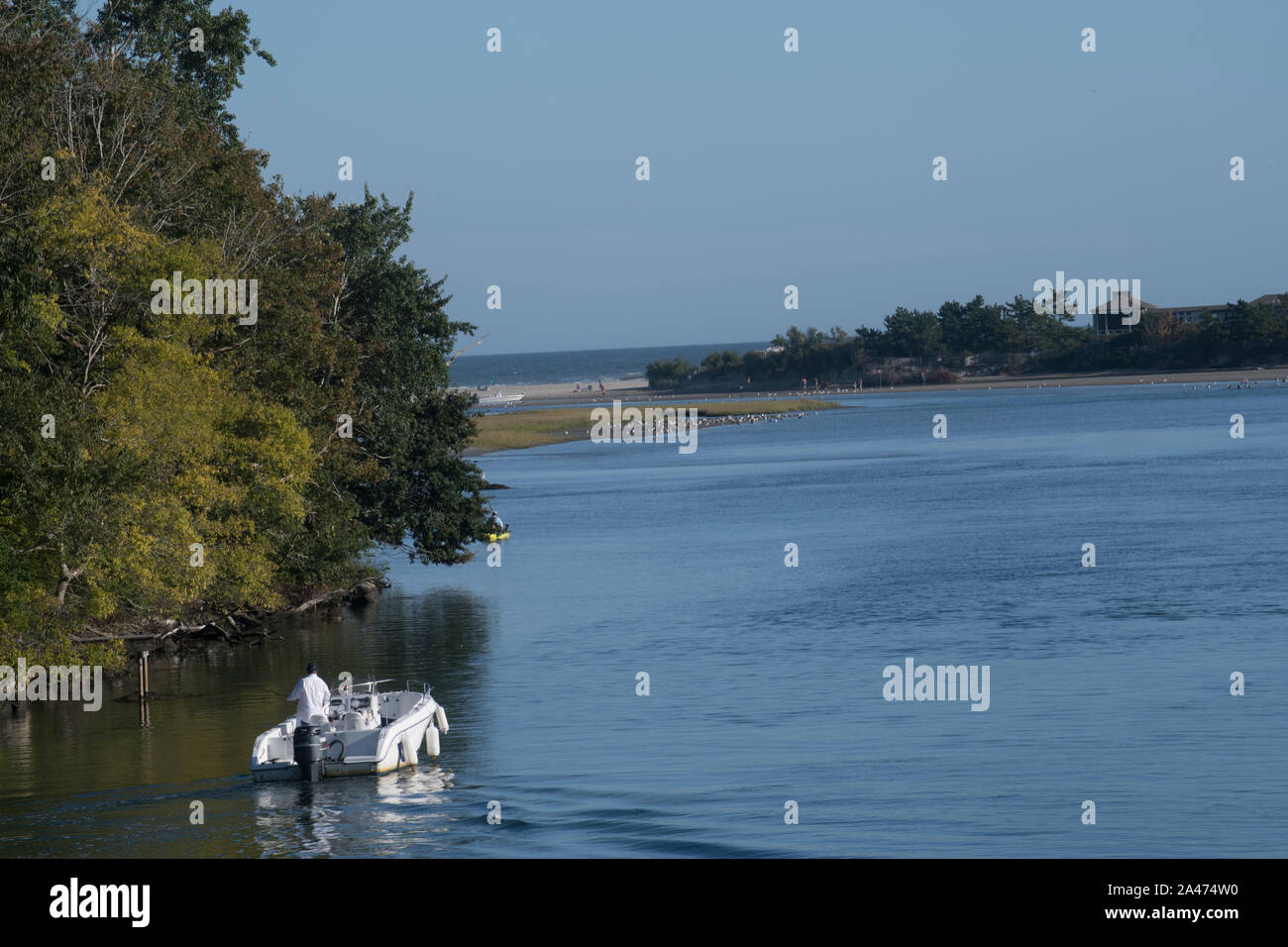 Fishing by boat in Narrow river Stock Photo - Alamy