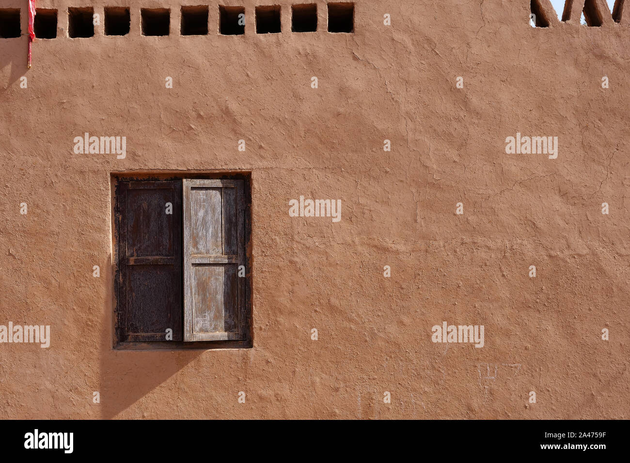 Ancient traditional residential old house wall and wooden window in ...