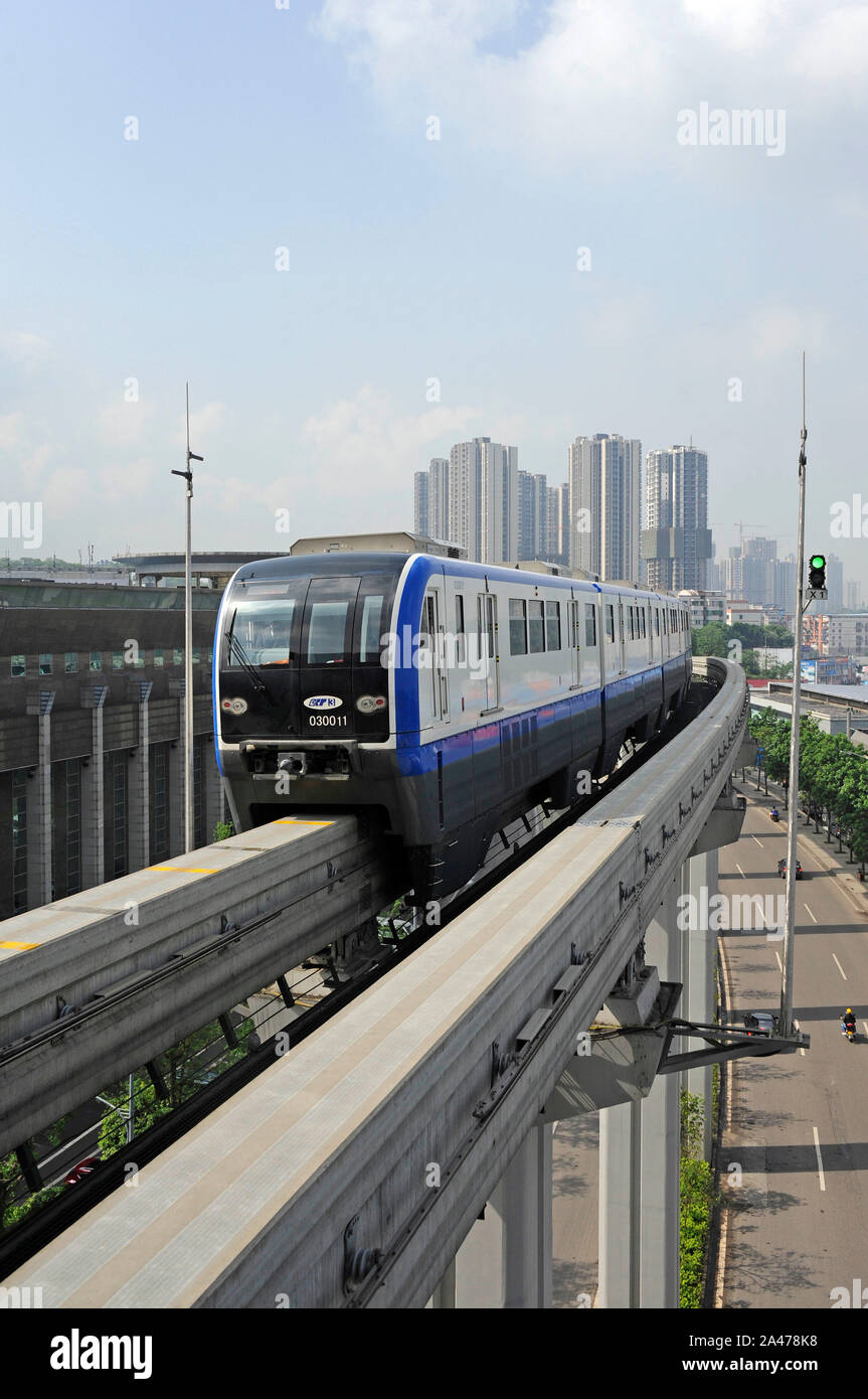 Monorail train approaches Bagongli station on Chongqing metro line 3 ...