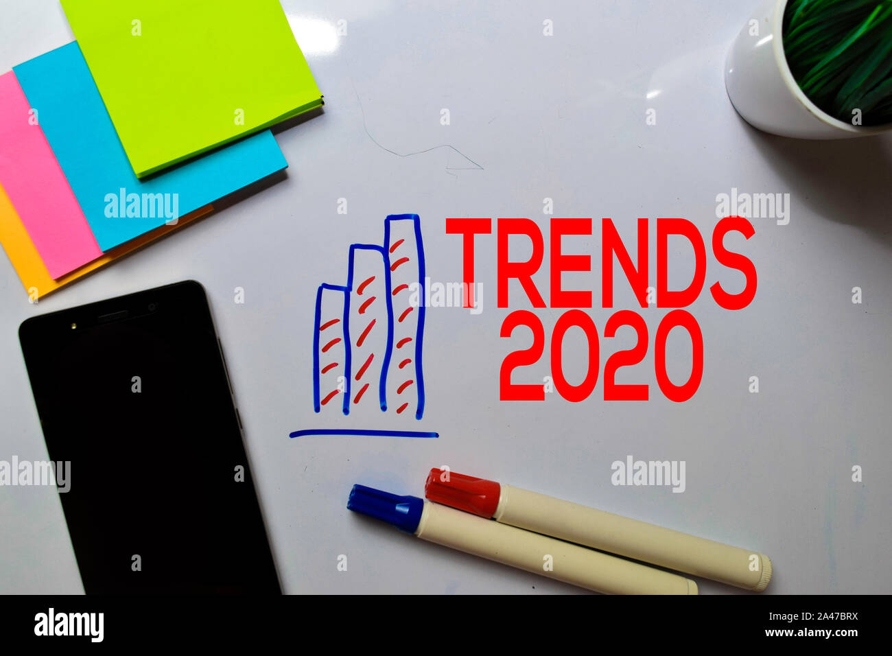 Trends 2020 Text on white board with chart,phone and sticky note Stock ...