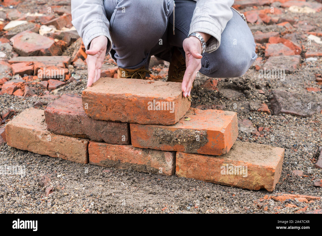 Woman is building something up Stock Photo - Alamy